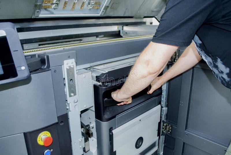 Worker Moves Working Camera of 3D Printer into 3D Printer. Industrial ...