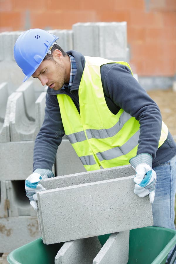 Worker Moving Concrete Block Stock Image - Image of concept, pile ...