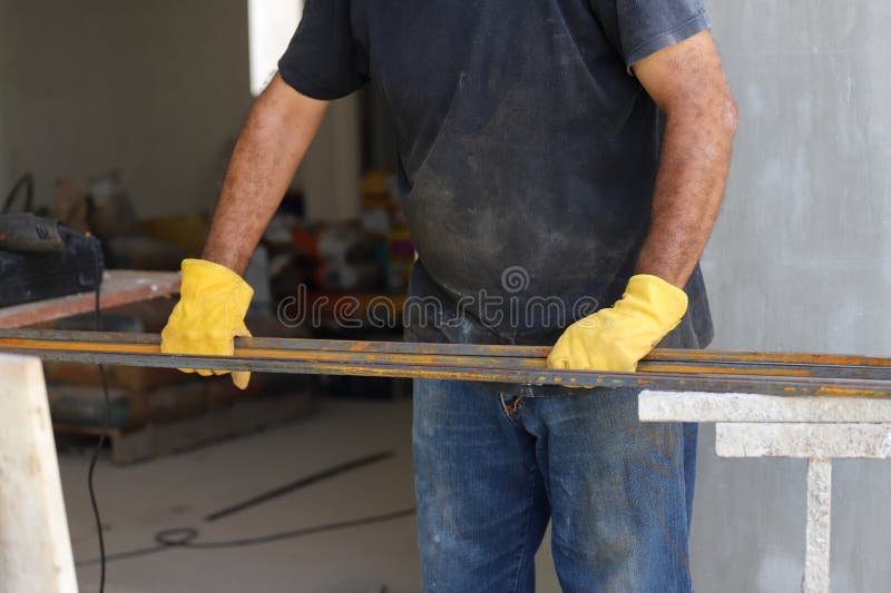 Worker Moving Iron Rods in Workshop Stock Image - Image of industry ...