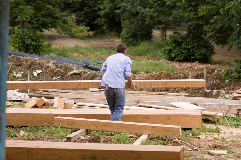 Worker moving wood stock image. Image of house, equipment - 41012749