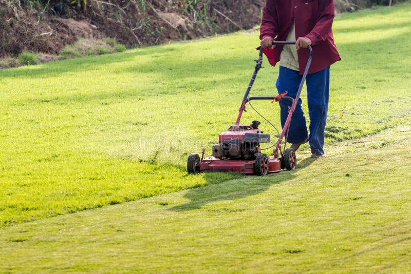 Worker mowing grass stock image. Image of people, mature - 46767497