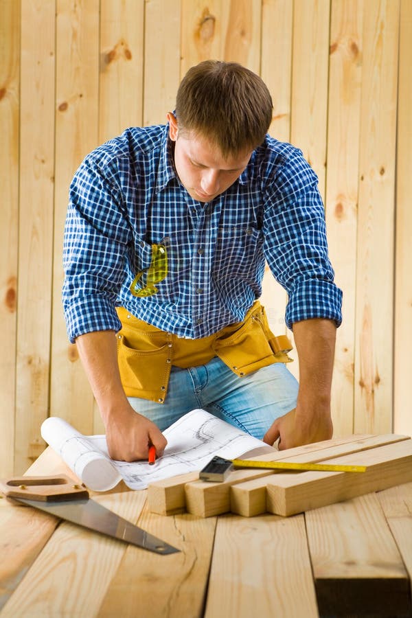 Worker near table stock image. Image of handsaw, camera - 25829783