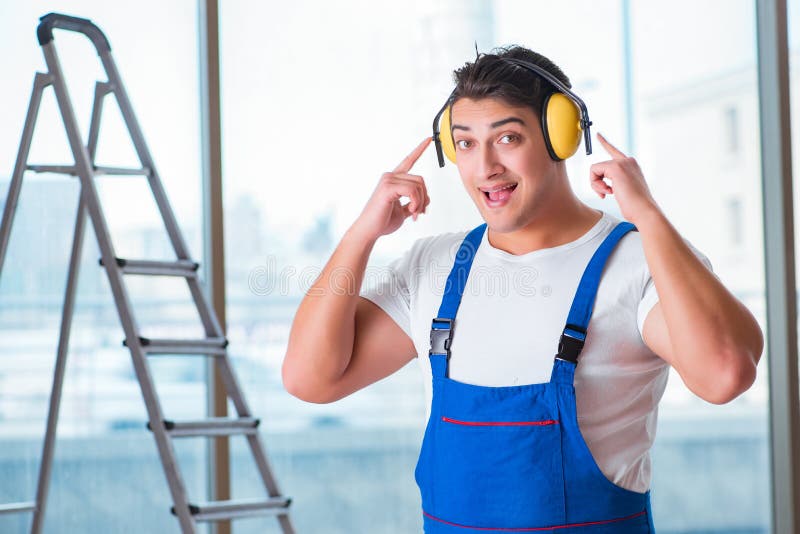 The Worker with Noise Cancelling Headphones Stock Image - Image of ...