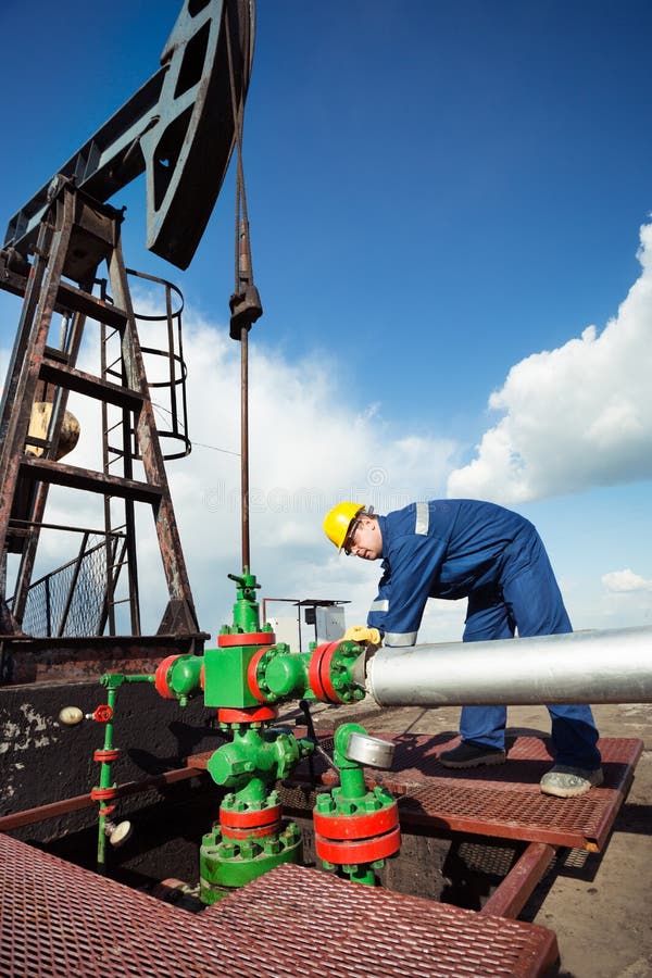 Worker on the oil field stock image. Image of industry - 52411685