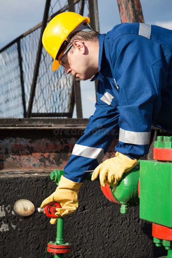 Worker on the oil field stock photo. Image of natural - 52412040