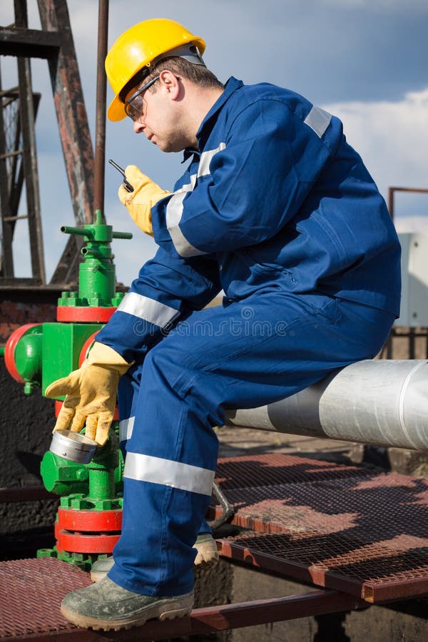 Worker on the oil field stock photo. Image of drilling - 52412106