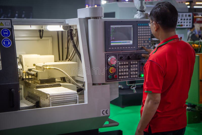Worker operate CNC machine editorial stock photo. Image of fabrication ... Worker operate CNC machine editorial stock photo. Image of fabrication ...