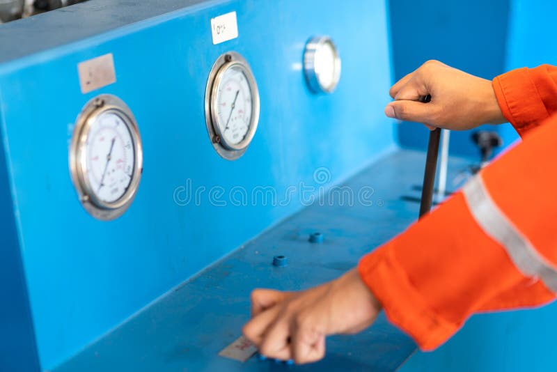 A Worker is Operate and Control the Machine. Stock Image - Image of ...