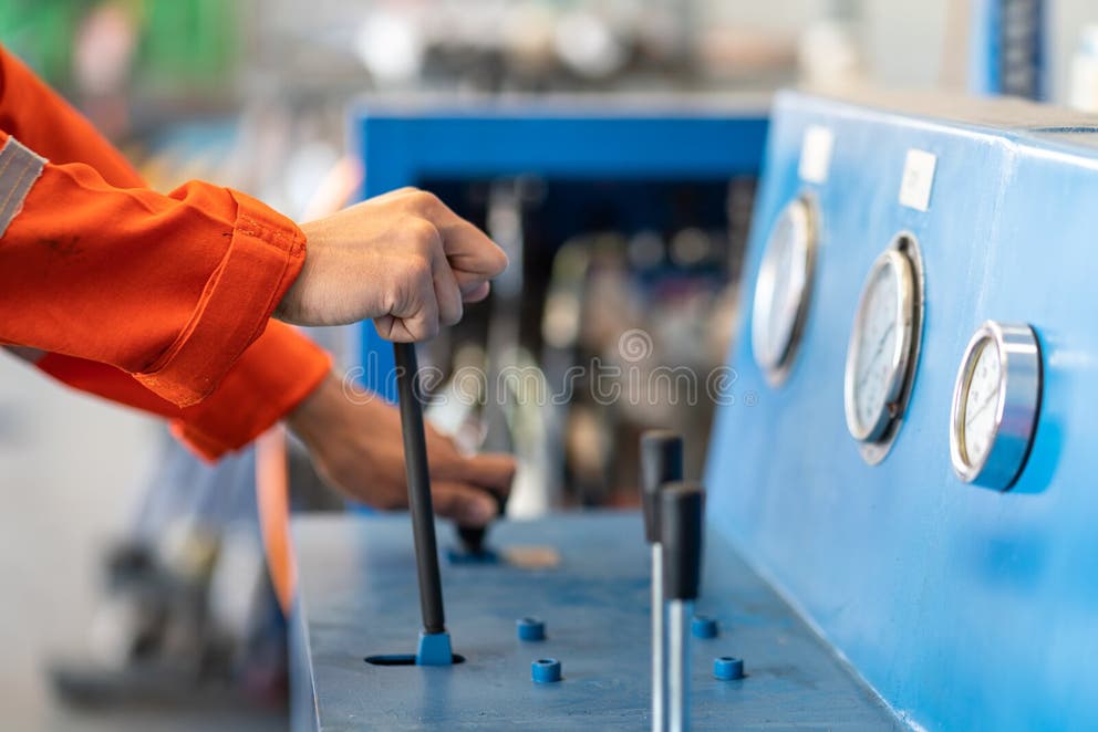 A Worker is Operate and Control the Machine. Stock Image - Image of ...