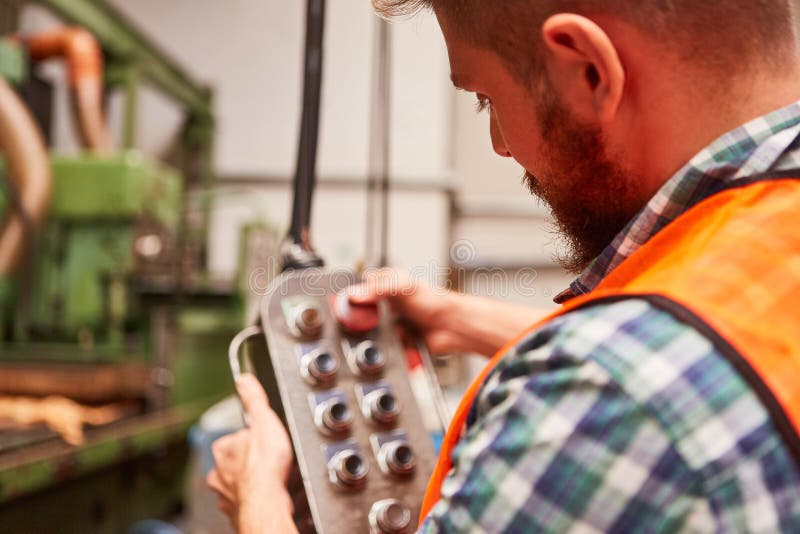 Worker Operates Buttons on the Control of a Machine Stock Image - Image ...