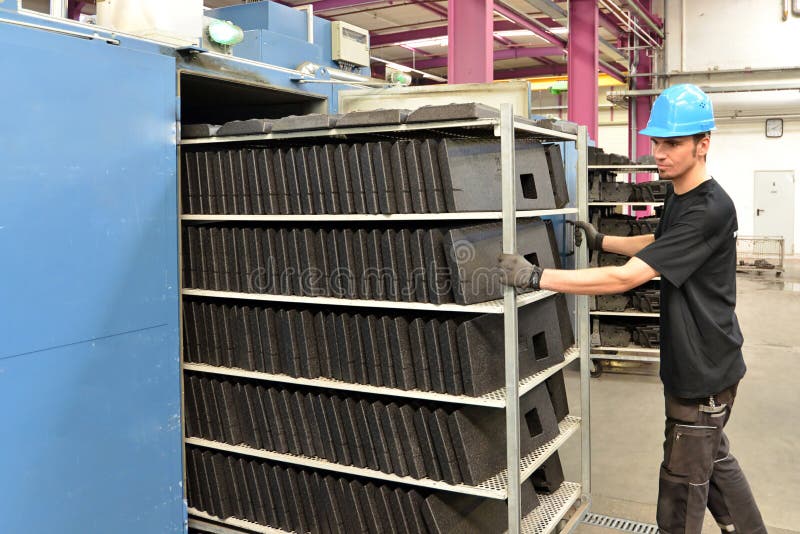 Worker Operates Machine in the Plastics Industry - Production of Stock ...