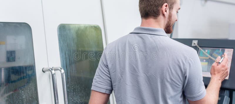 Worker Operating Computer-controlled Machine Tool Stock Photo - Image ...
