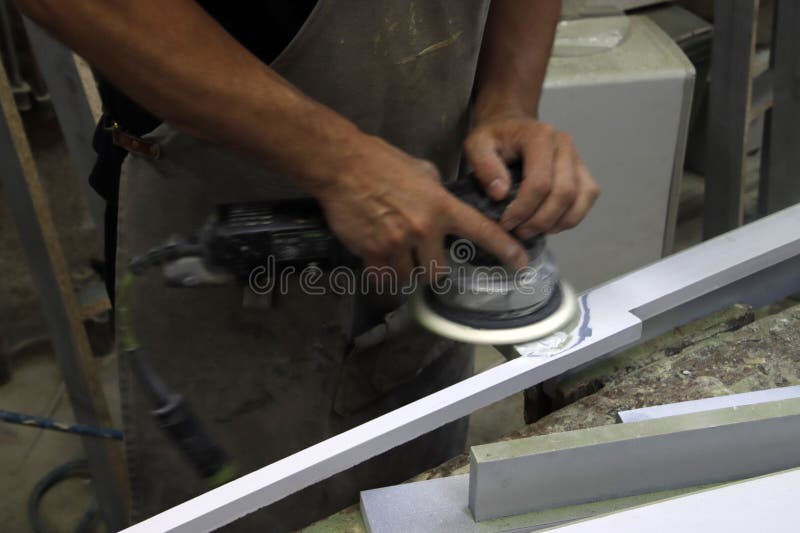 A Person Using a Grinder To Work on Something Like Concrete Stock Photo ...