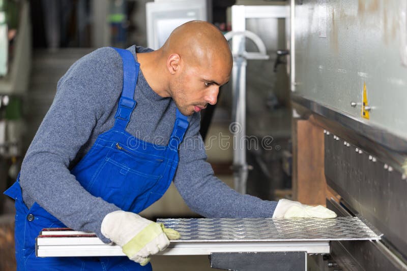 Worker Operating Machine for Bending Sheet Metal Stock Image - Image of ...