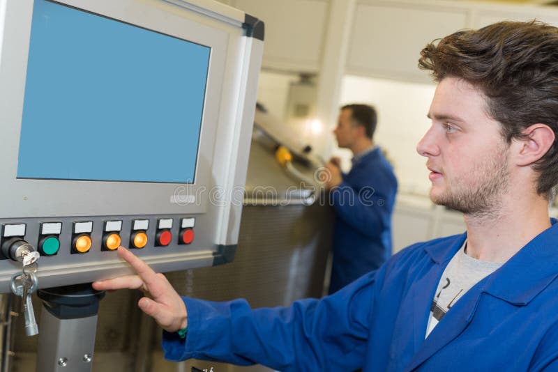Worker Operating Machine in Factory Stock Image - Image of computer ...