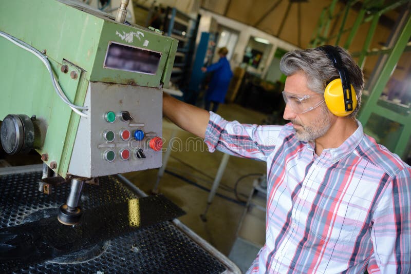 Worker Operating Machine in Factory Stock Image - Image of screen ...