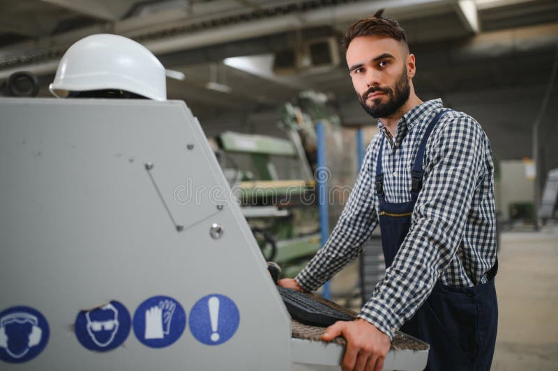 Worker Operating Machine in Factory Stock Photo - Image of frame, door ...