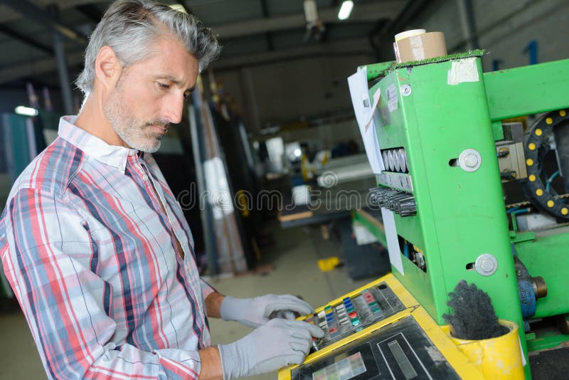 Worker Operating Machine in Factory Stock Image - Image of circular ...