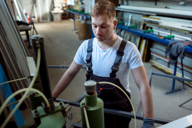 Worker Operating Welding Machine in Factory. Stock Image - Image of ...