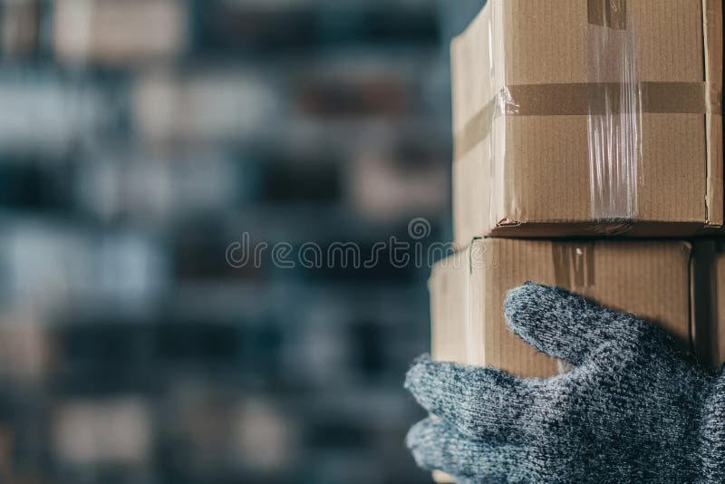 Worker Organizing Boxes in Warehouse Setting Stock Image - Image of ...
