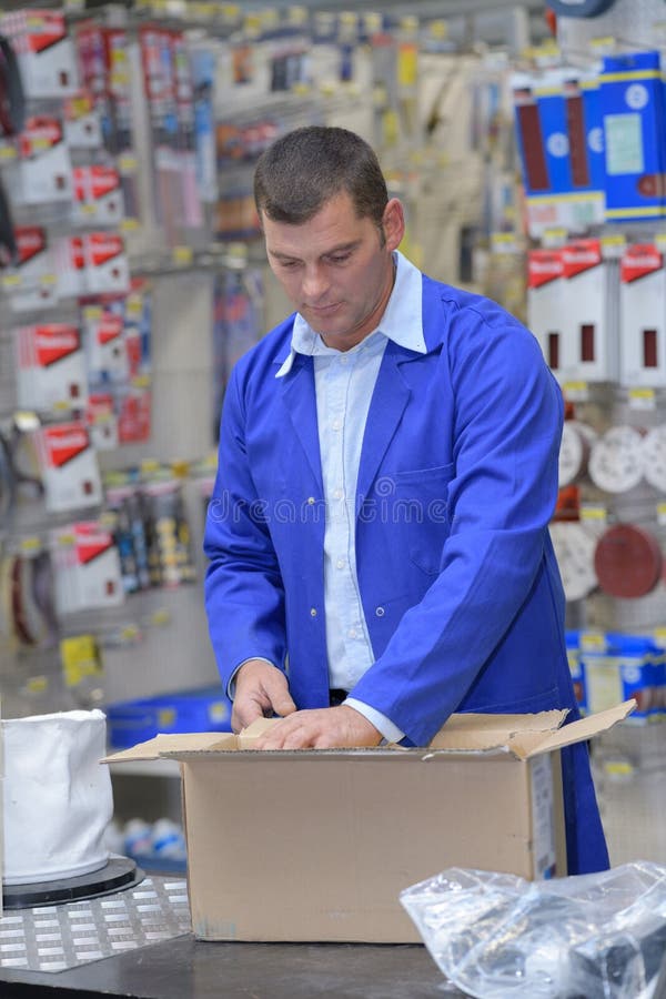 Worker Packing Order into Cardboard Box Stock Photo - Image of hold ...