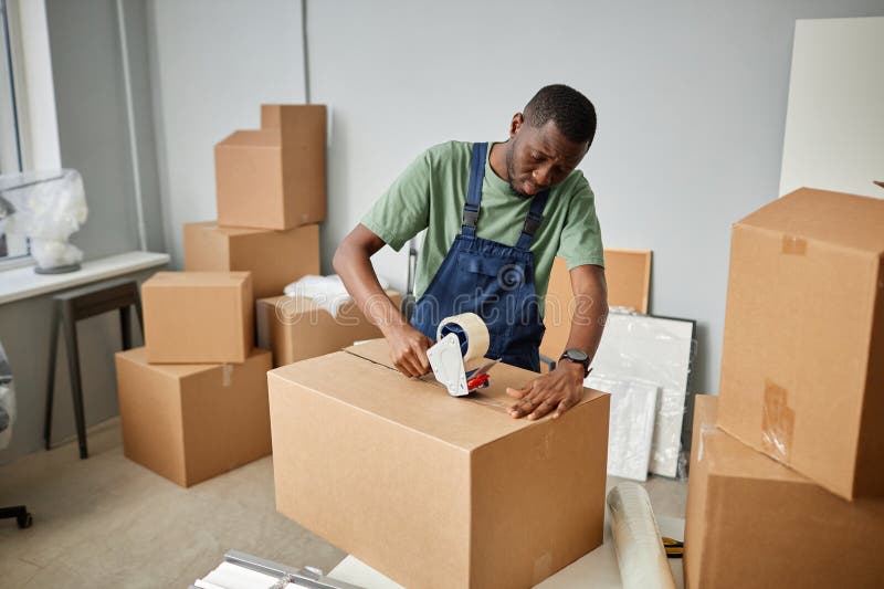 Worker Packing Things in Box Stock Photo - Image of estate, move: 271996544