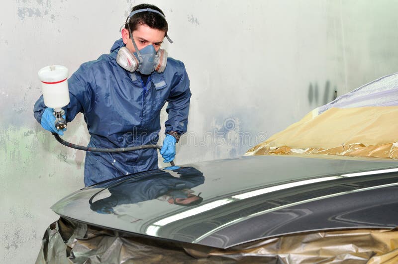 Worker painting a car. stock photo. Image of spray, paper - 24857696