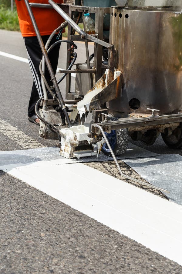 Worker and Painting Machine Work on the Street Stock Image - Image of ...