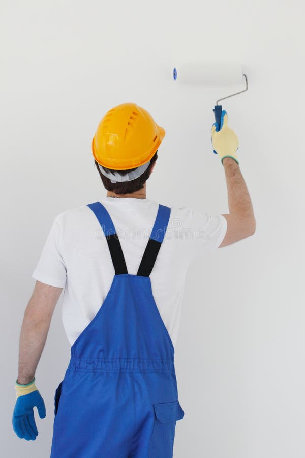 Worker painting wall stock image. Image of caucasian - 87800525