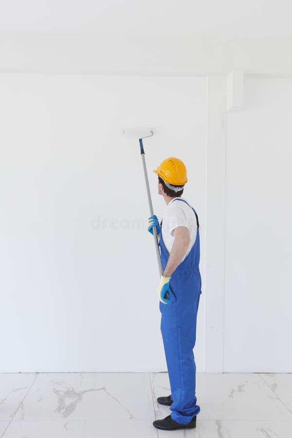 Worker painting wall stock image. Image of paint, renovation - 75483265