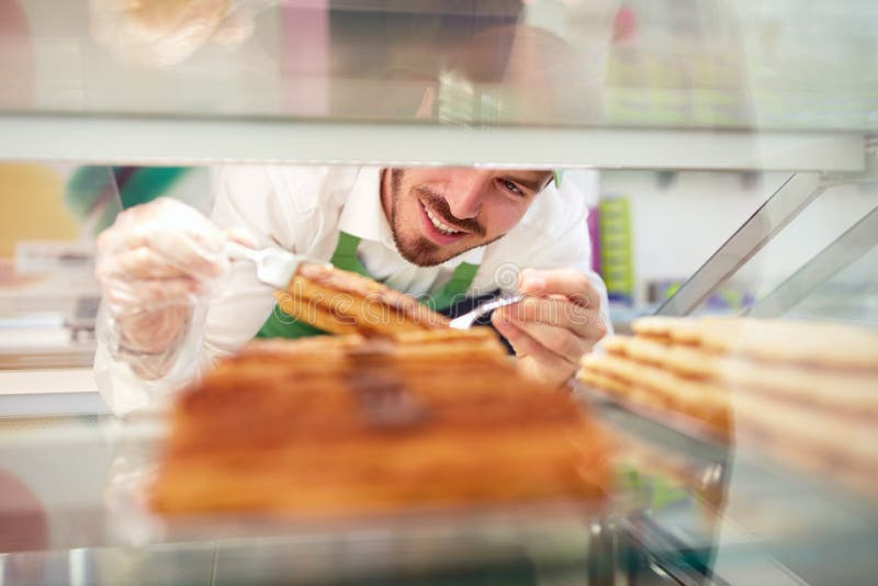 Worker in Pastry Shop Taking Piece of Cake Stock Image - Image of ...