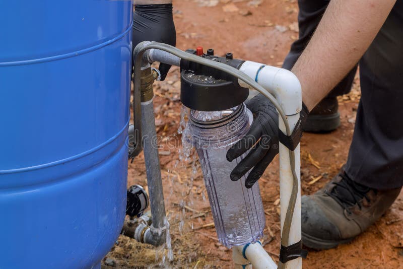 Worker Performs Maintenance Work To Replace a Filter in Domestic Water ...