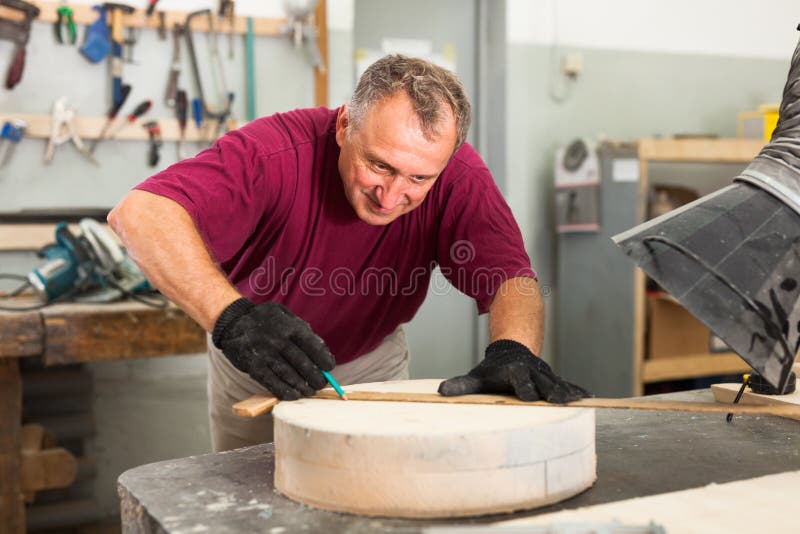 Worker Performs Measurements on Wooden Workpiece with Caliper. Working ...
