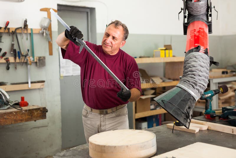 Worker Performs Measurements on Wooden Workpiece with Caliper. Working ...