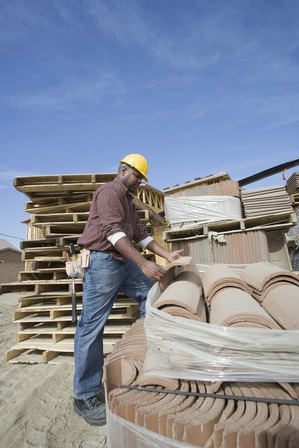 Worker Picking a Tile at Site Stock Image - Image of incomplete ...