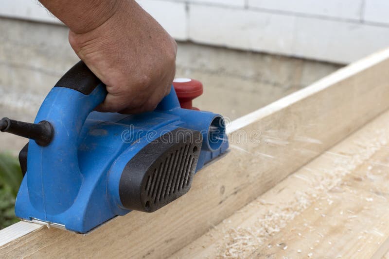 Worker is planing boards stock image. Image of sawdust - 337621207