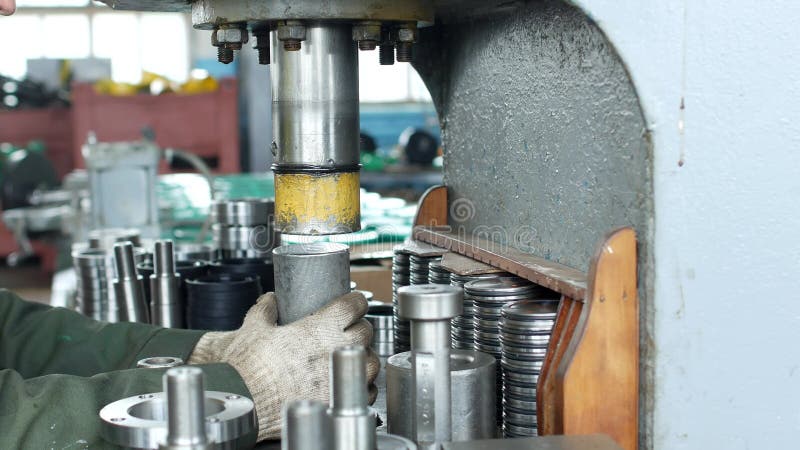 The Worker at the Plant Presses the Bearing into the Hub Using a Press ...
