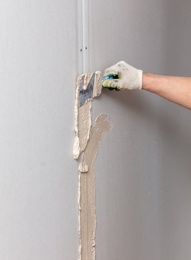 A Worker is Plastering a Wall with a Plastering Tool. Stock Photo ...