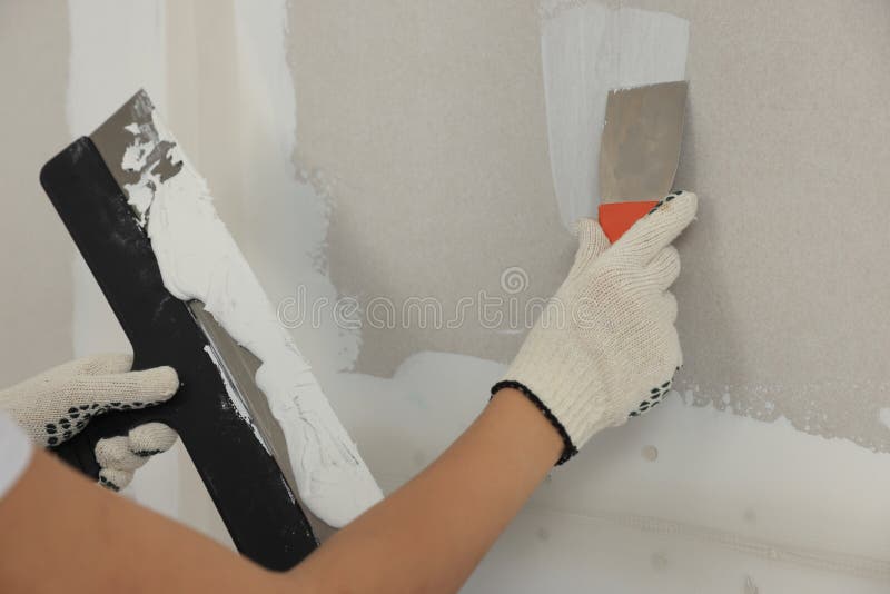 Worker Plastering Wall with Putty Knives, Closeup Stock Image - Image ...