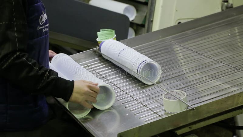 Stacks of Plastic Cups on a Conveyor Belt in a Plastic Packaging ...