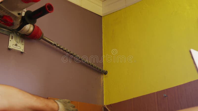 Man Pneumatic Hammer Drill a Hole in the Wall. a Worker Using an ...