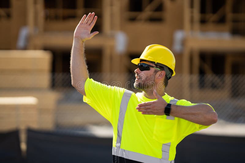 Worker Pointing Out. Builder in a Hard Hat Working on a Construction ...
