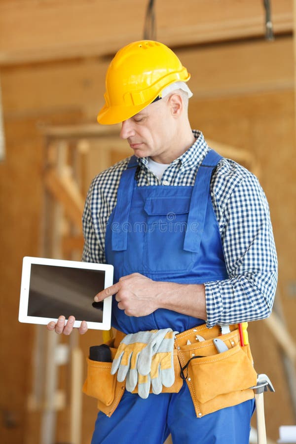 Worker pointing at tablet stock image. Image of digital - 87800561