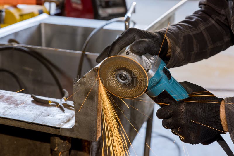 Worker Polishes a Metal Surface with a Grinder Stock Photo - Image of ...