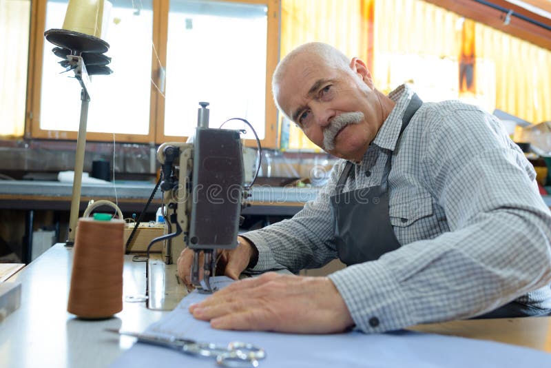 Worker Posing Next To Sewing Machine Stock Photo - Image of skin ...