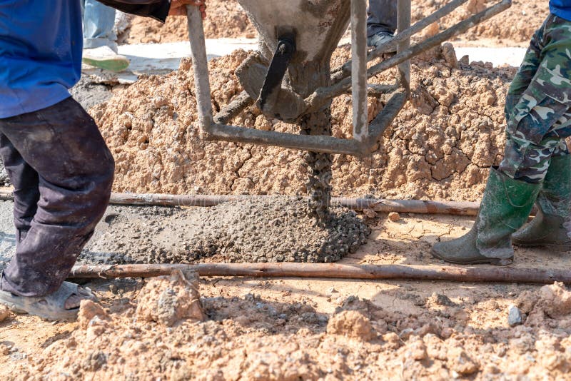 Worker Pour Lean Concrete on Formwork before Steel Rebar Foundation ...