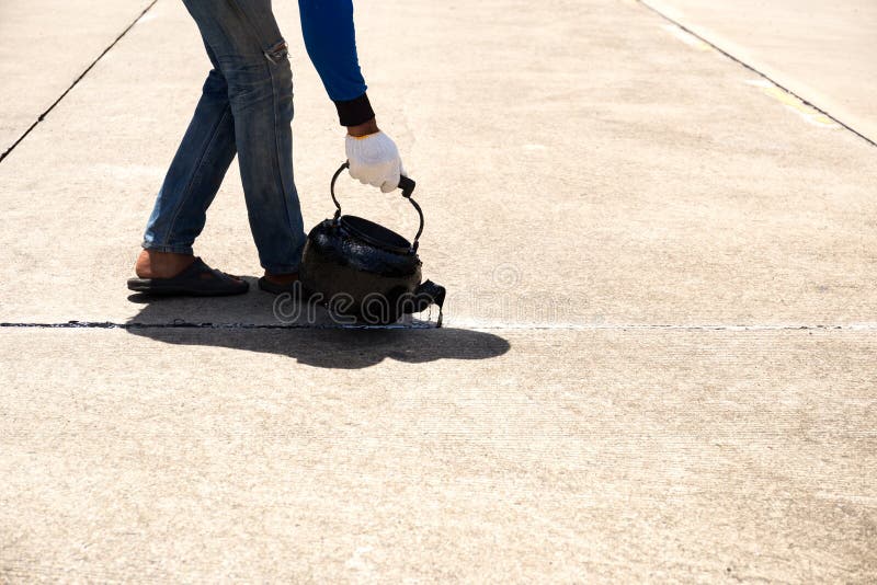Pouring Asphalt Sealant on Driveway Stock Image - Image of pouring ...