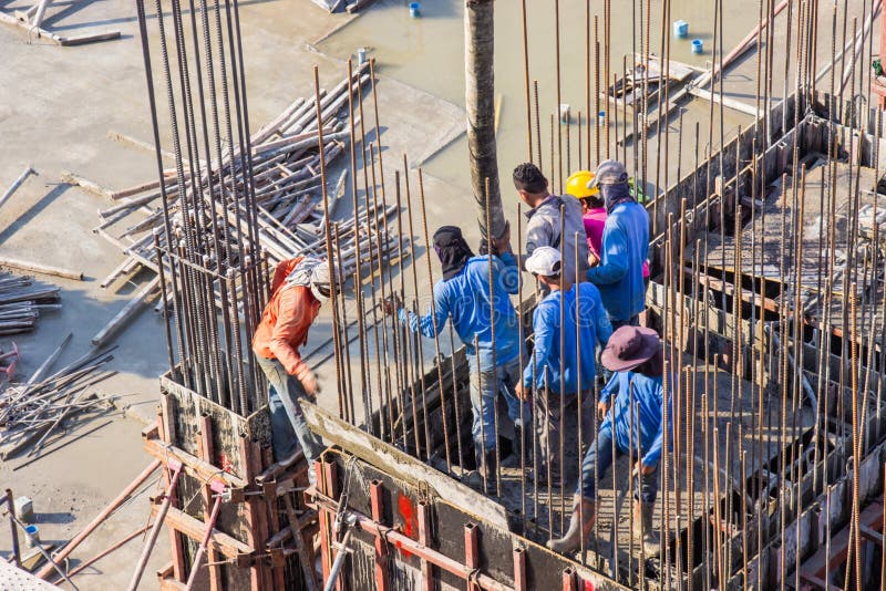 Worker Pouring Cement Pouring into Foundations and Pillars Formwork at ...