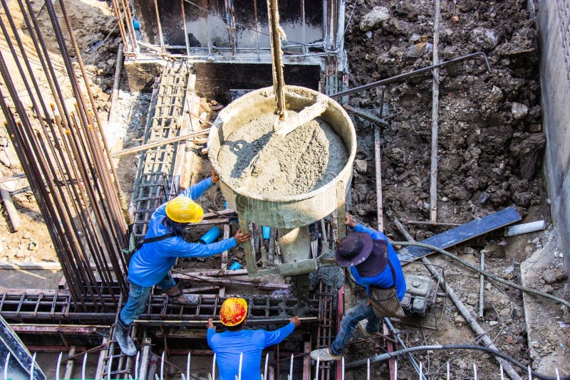 Worker Pouring Cement Pouring into Foundations Formwork at Building ...