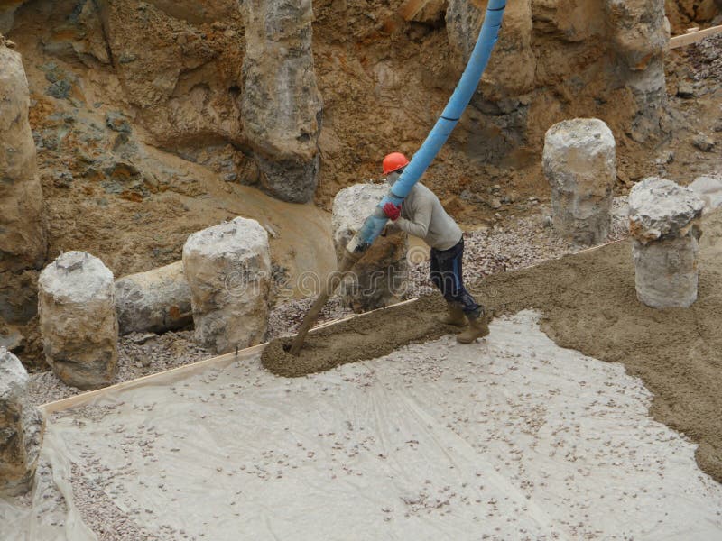 Worker pouring concrete stock image. Image of process - 142168875